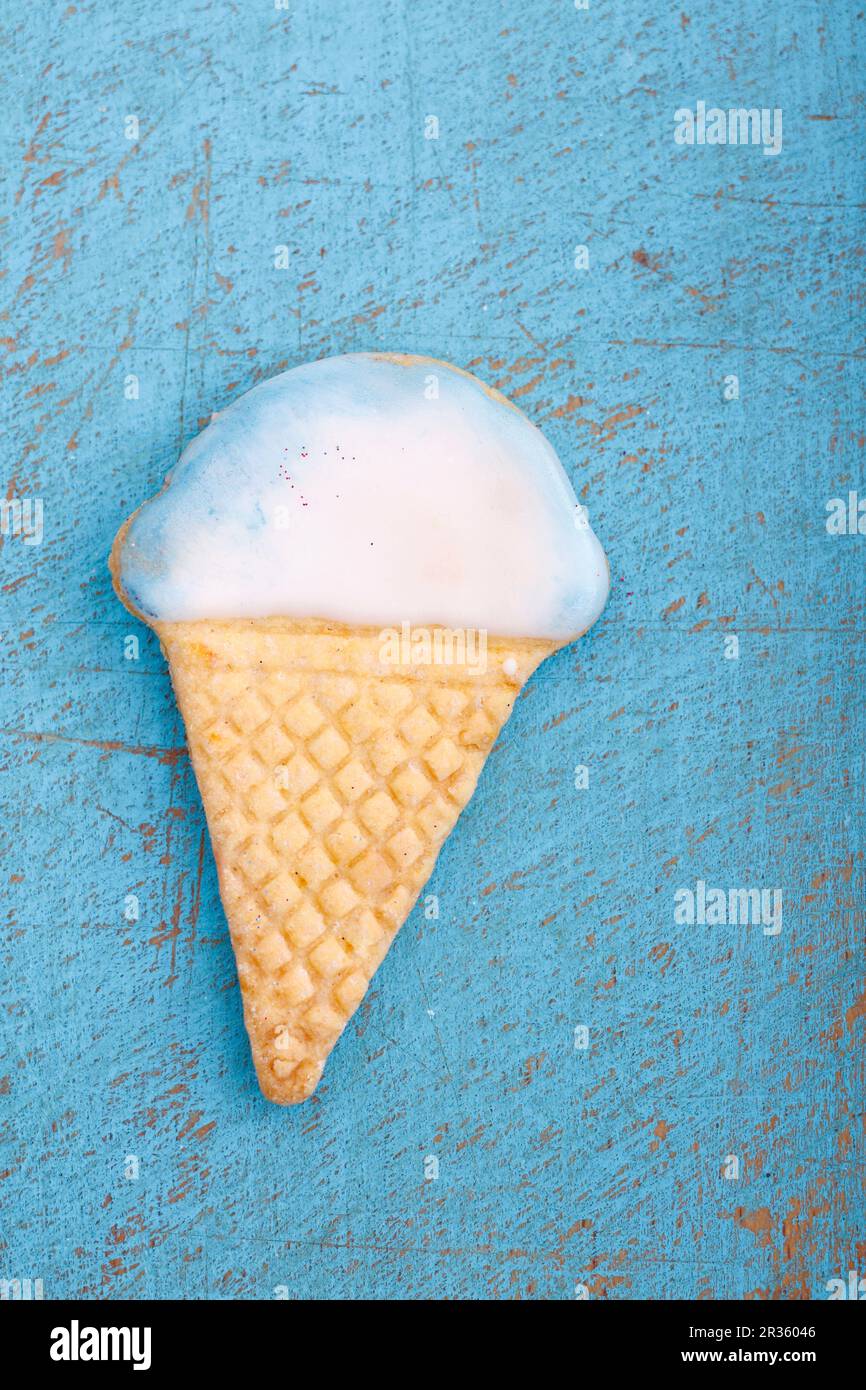 An ice cream-shaped biscuit with white icing Stock Photo - Alamy