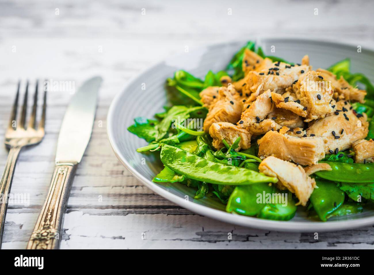 Grilled chicken with spinach, rocket and peas Stock Photo - Alamy