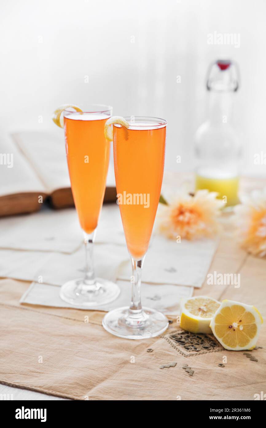 Cava cocktails with lemon for two Stock Photo - Alamy