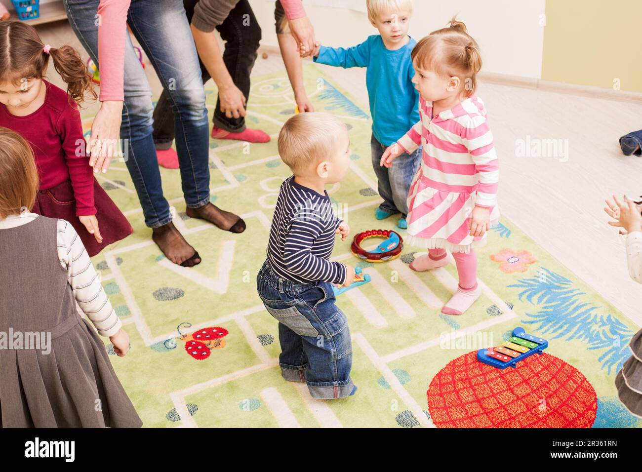 Group of little children dancing Stock Photo - Alamy