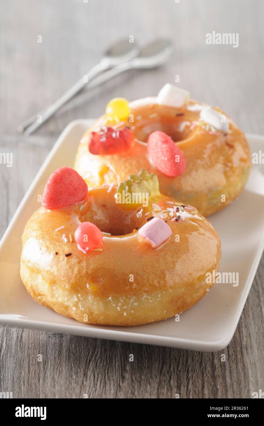 Plate of decorated doughnuts hi-res stock photography and images - Alamy