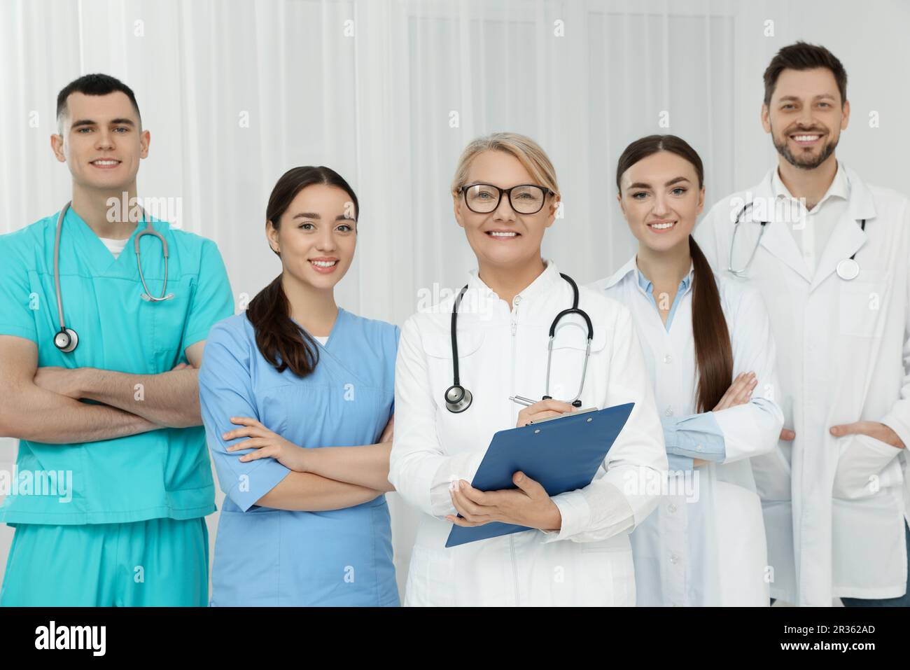 Portrait of medical doctors wearing uniforms indoors Stock Photo - Alamy