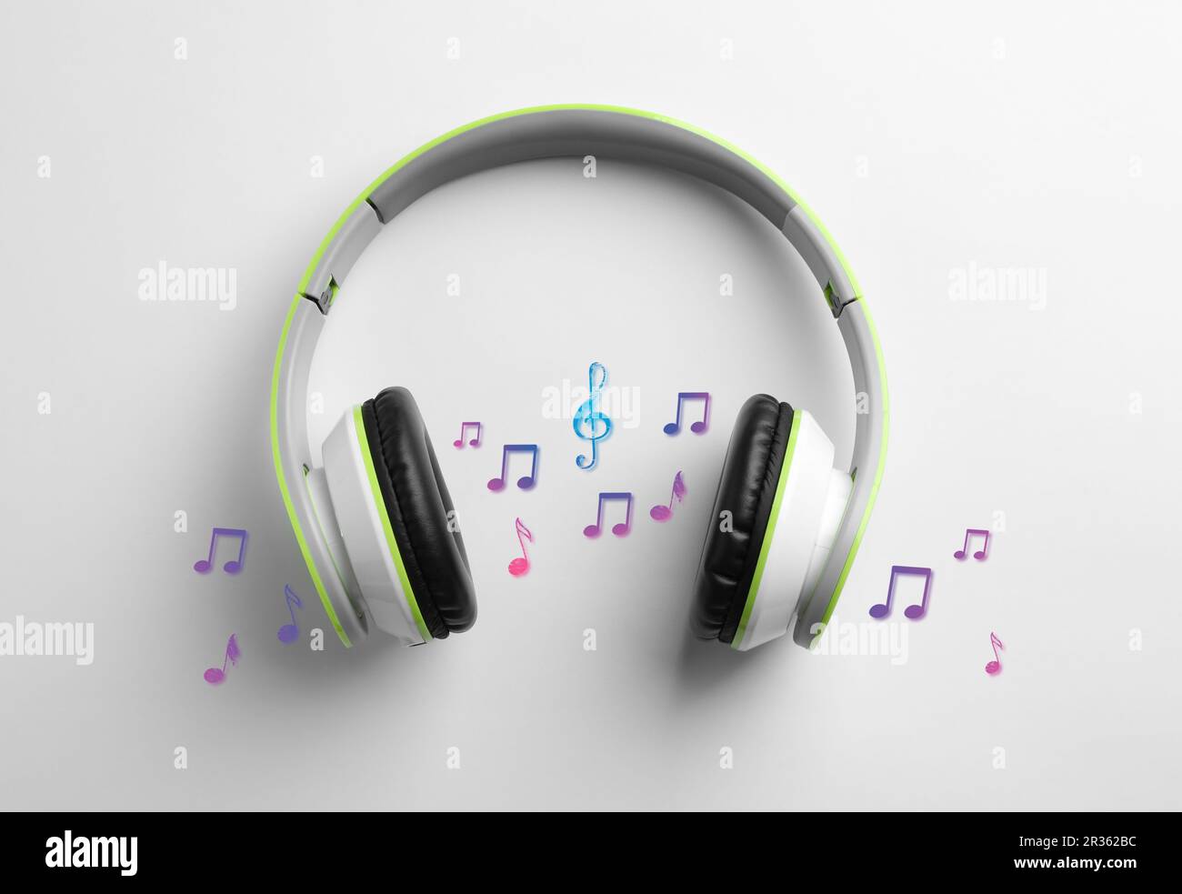 Headphones, colorful music notes and treble clef on white background ...