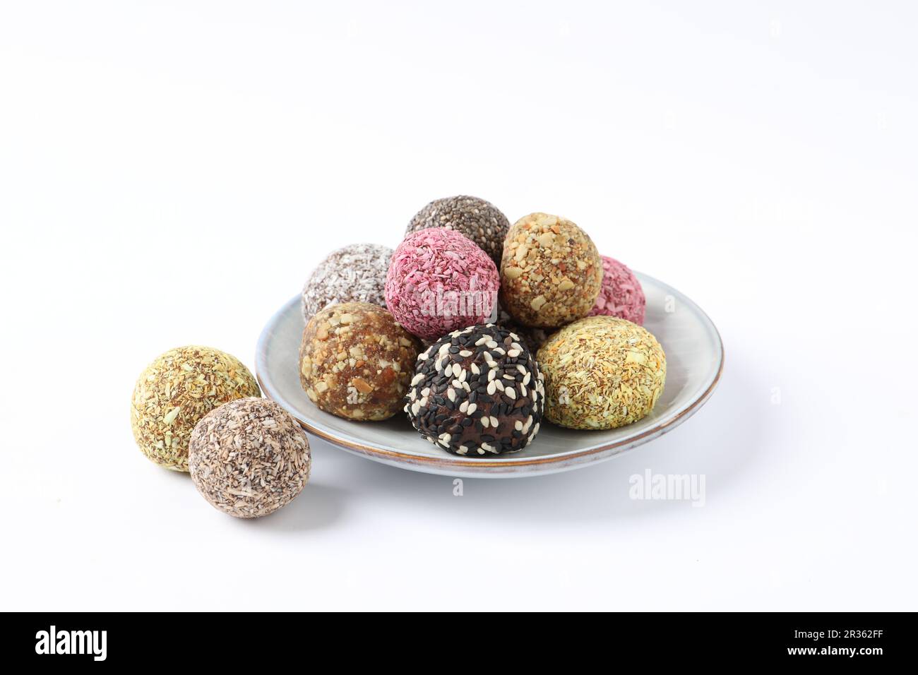 Different delicious vegan candy balls on white background Stock Photo ...