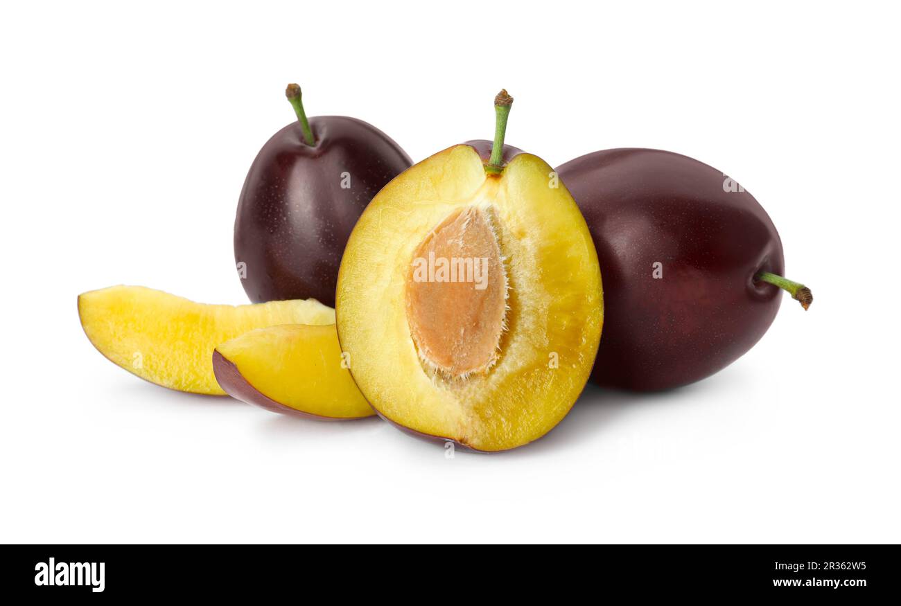 Whole and cut ripe plums on white background Stock Photo - Alamy