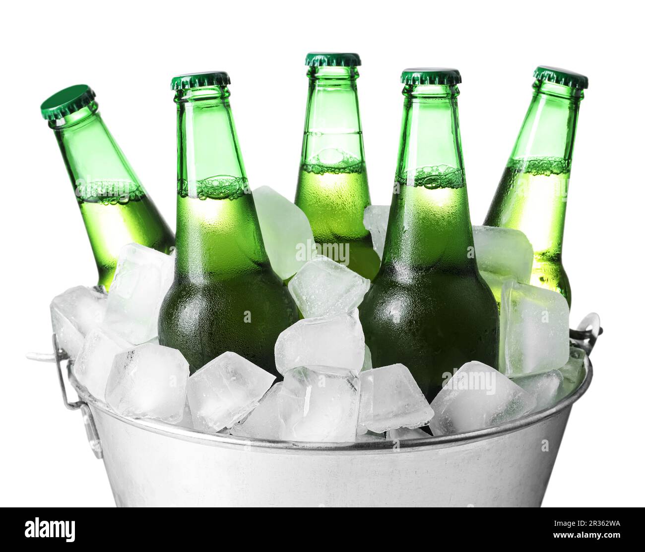 Metal bucket with bottles of beer and ice cubes on white background ...
