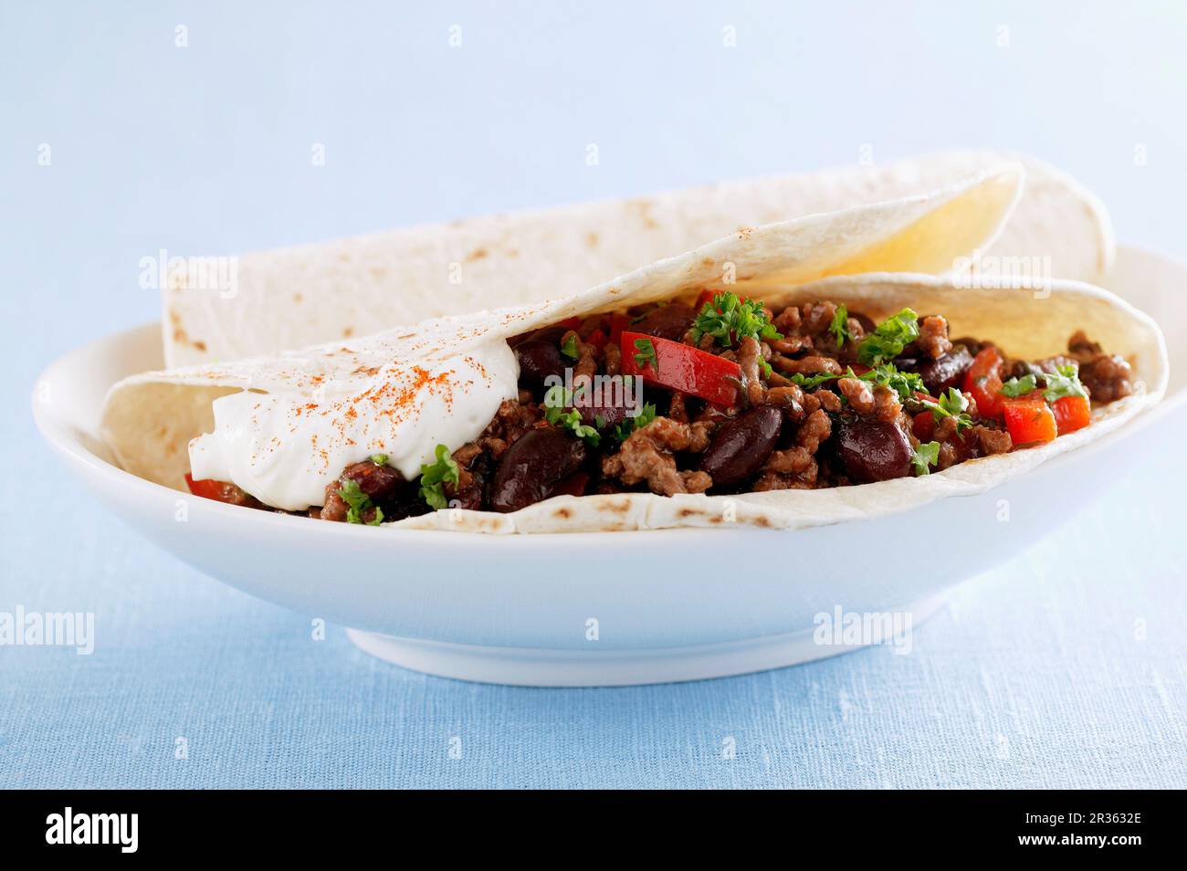 Tortillas with chilli con carne Stock Photo - Alamy