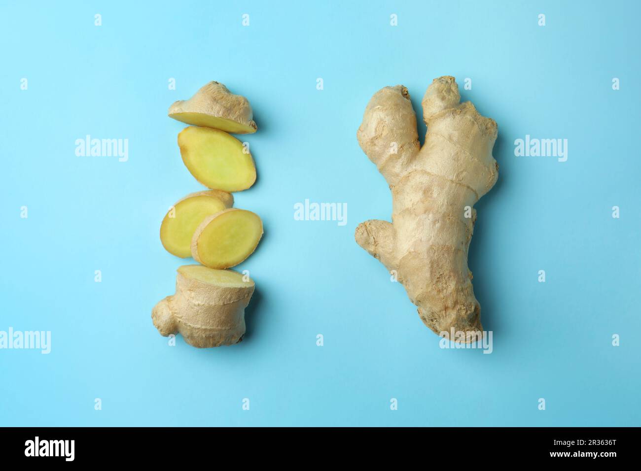 Fresh ginger on pale light blue background, flat lay Stock Photo - Alamy