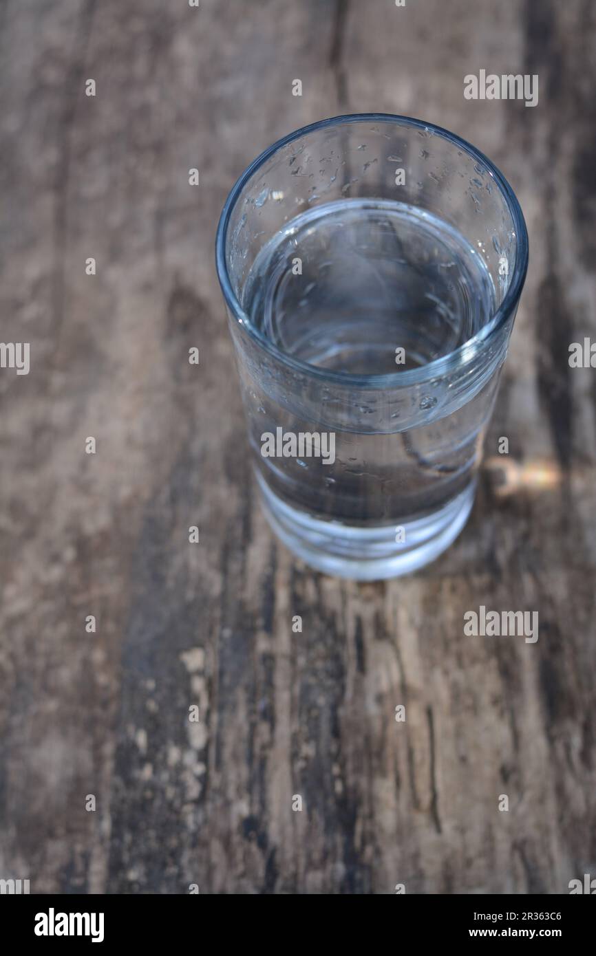 Glass of water outdoors, space for text Stock Photo - Alamy