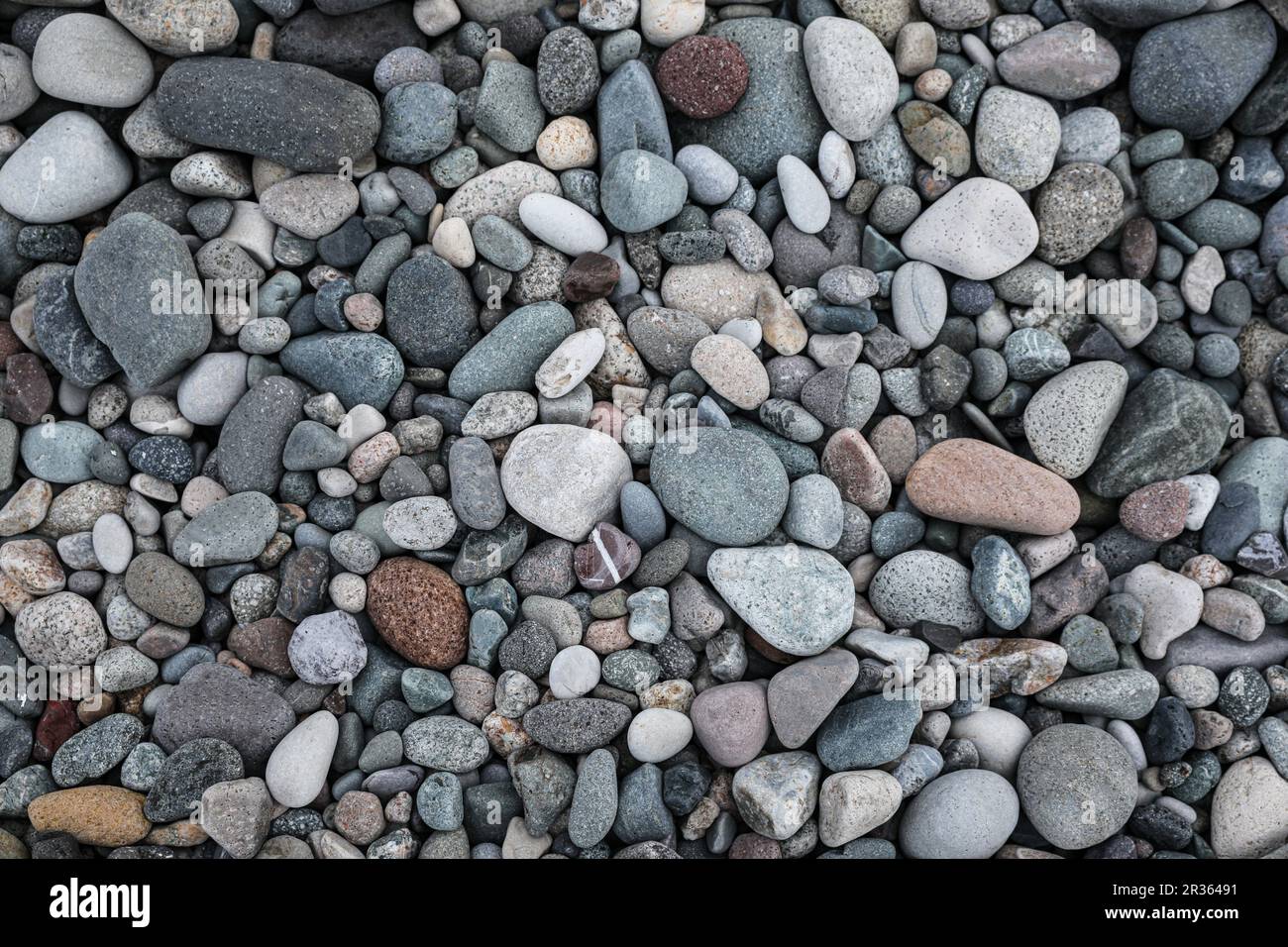 Many different pebbles as background, top view Stock Photo - Alamy
