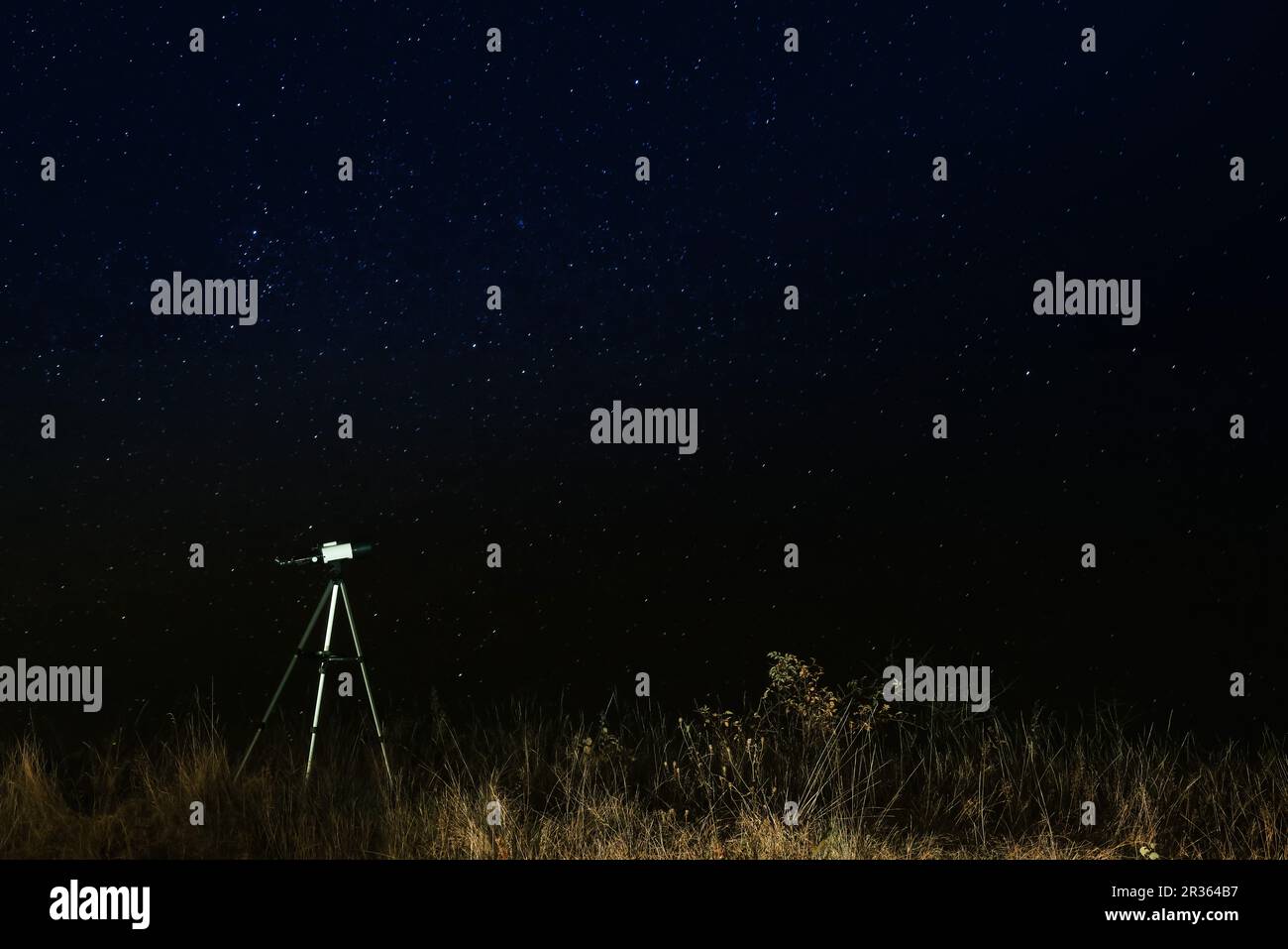 Modern telescope and beautiful sky in night outdoors. Learning ...