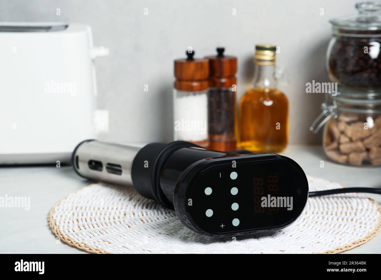 Thermal immersion circulator on table in kitchen, closeup. Sous vide ...