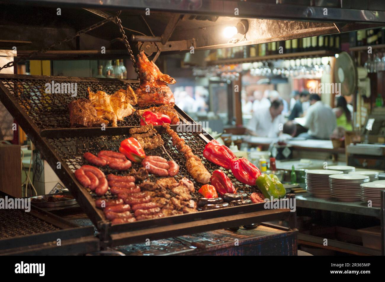 Man cooking meats hi-res stock photography and images - Alamy