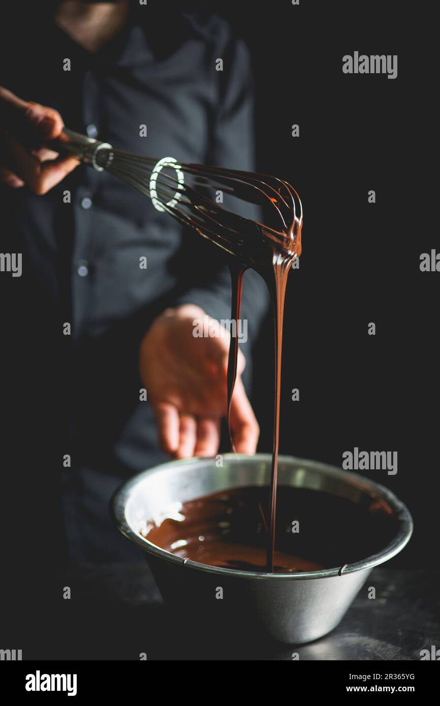 Liquid chocolate dripping from steel hi-res stock photography and ...
