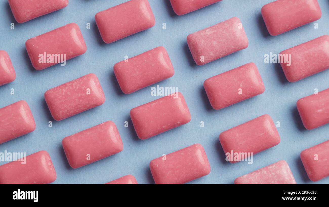 Many sweet chewing gums on light blue background, flat lay Stock Photo ...
