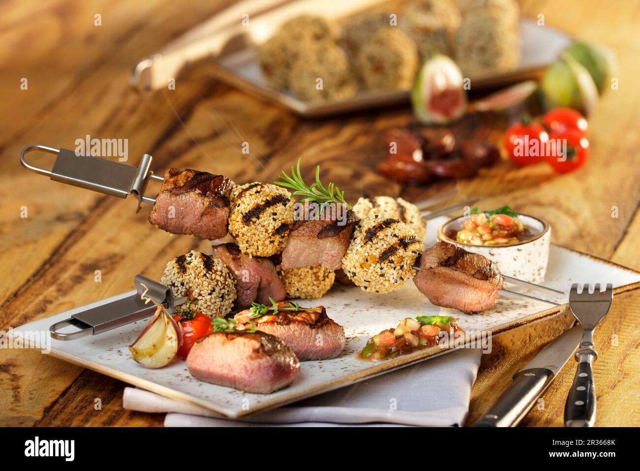 Lamb and falafel skewers with fig and date chutney Stock Photo - Alamy