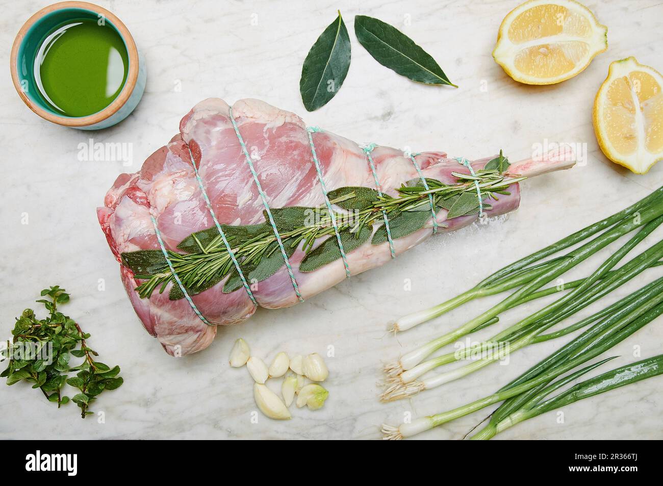 A raw leg of lamb with ingredients Stock Photo - Alamy