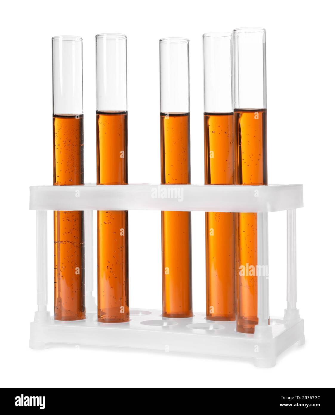 Test tubes with brown liquid in stand on white background Stock Photo ...