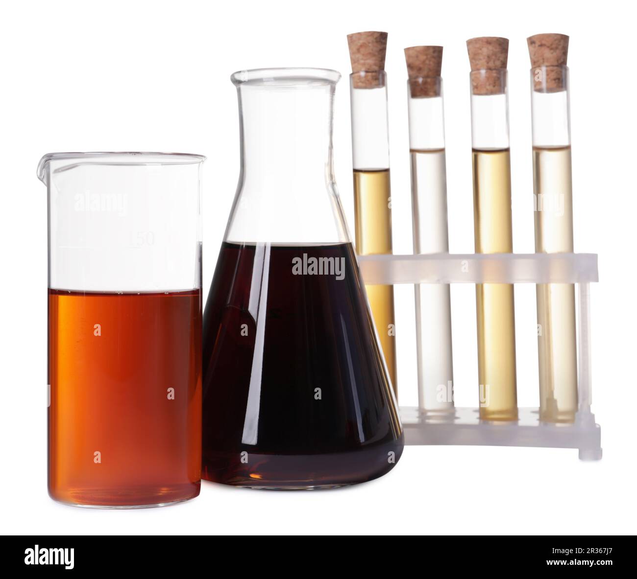 Different laboratory glassware with brown liquids on white background ...
