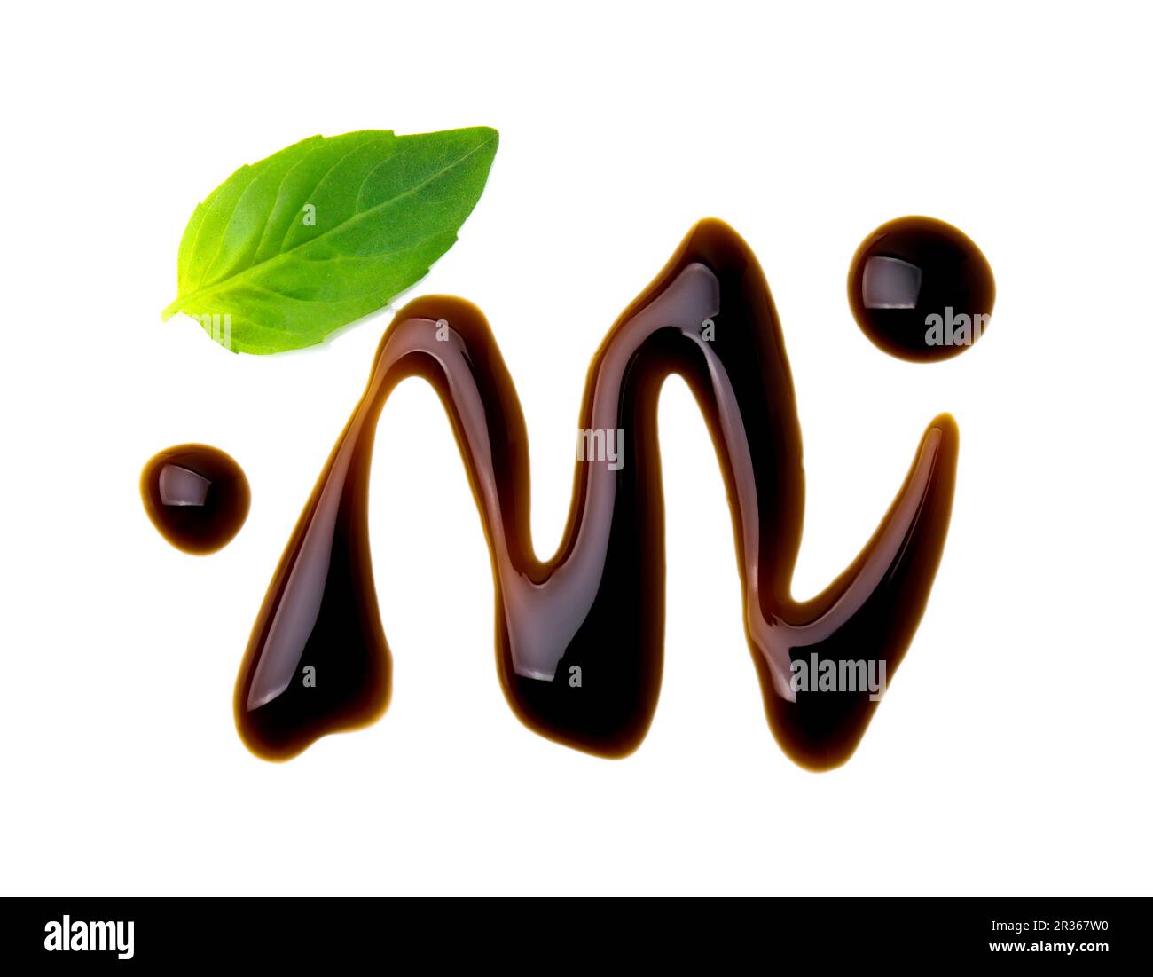 Balsamic glaze and basil leaf on white background, top view Stock Photo ...
