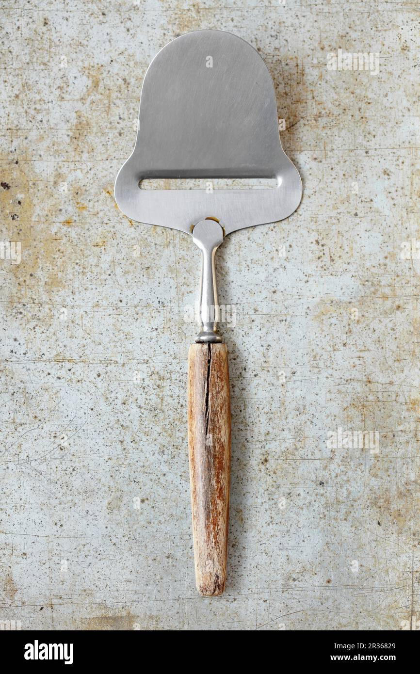 A vintage cheese cutter Stock Photo - Alamy
