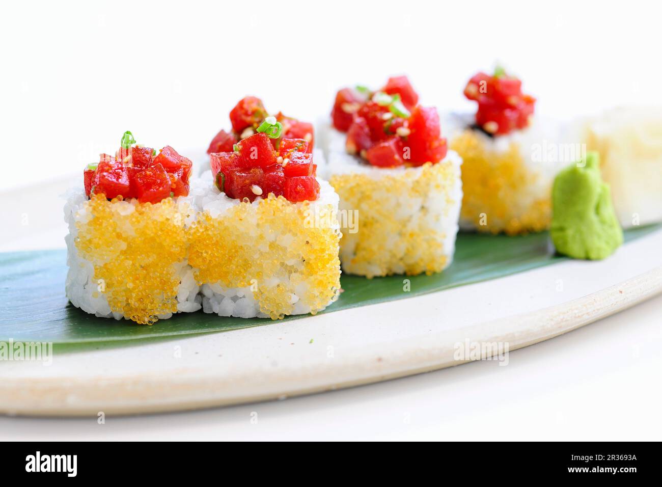 Ura-maki with tomato coulis and flying fish roe Stock Photo - Alamy