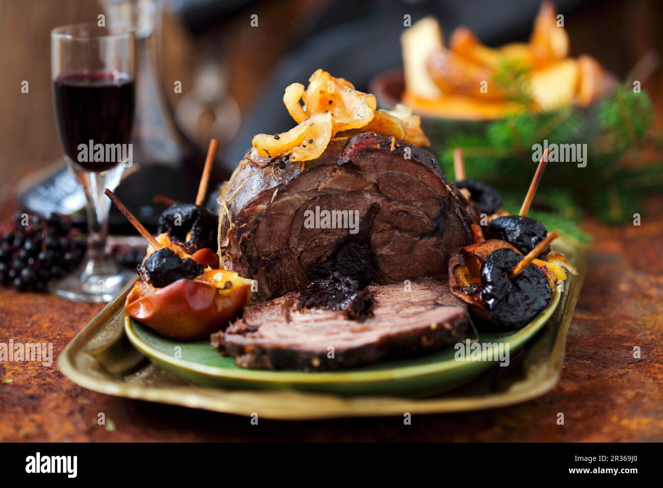 Roast wild boar with a plum stuffing Stock Photo - Alamy