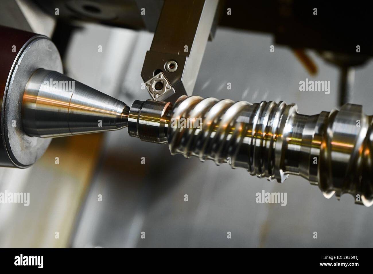 Milling machine tool operates with metal workpiece at plant Stock Photo ...