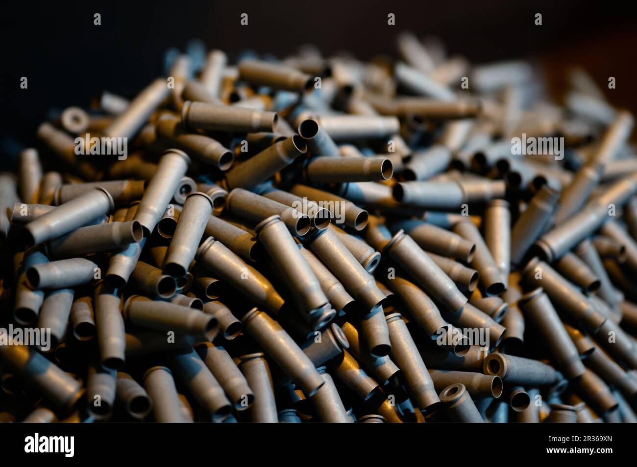Bullet casings pile in weapon production plant storage Stock Photo - Alamy