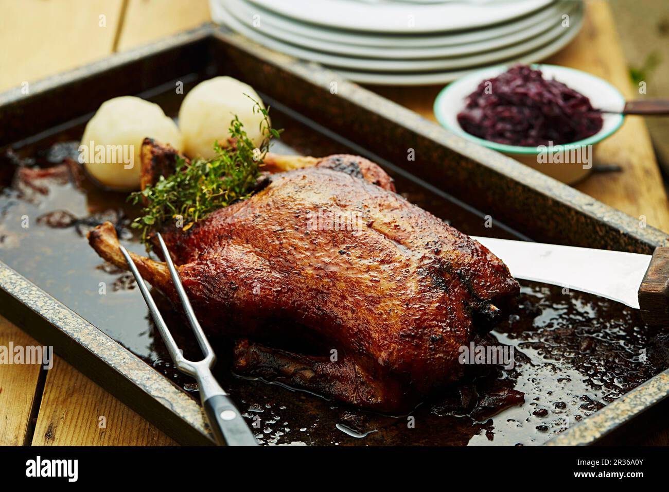 Roasted wild goose with red cabbage and dumplings Stock Photo - Alamy