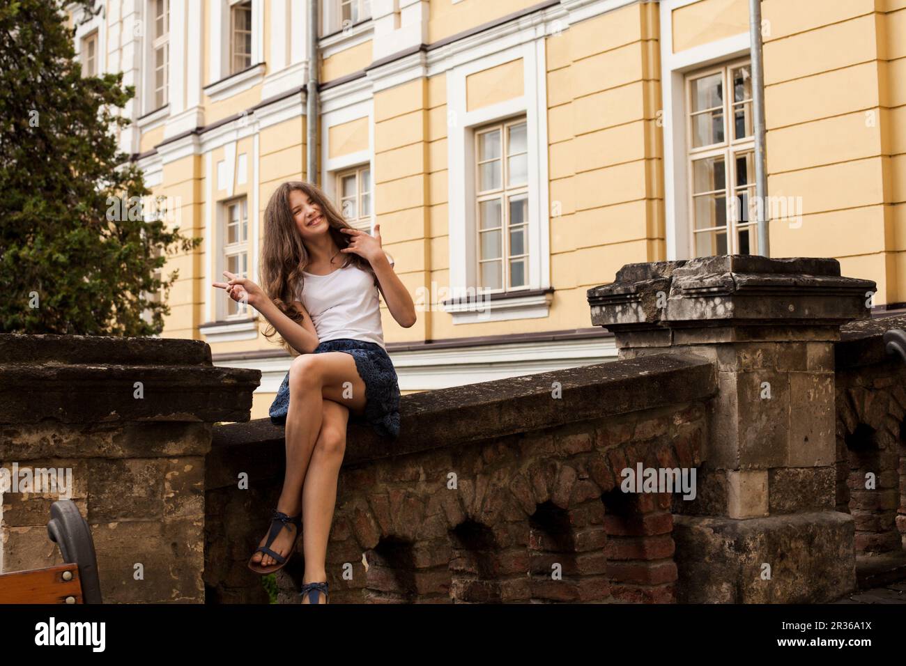 Girl near the hight school building Stock Photo - Alamy