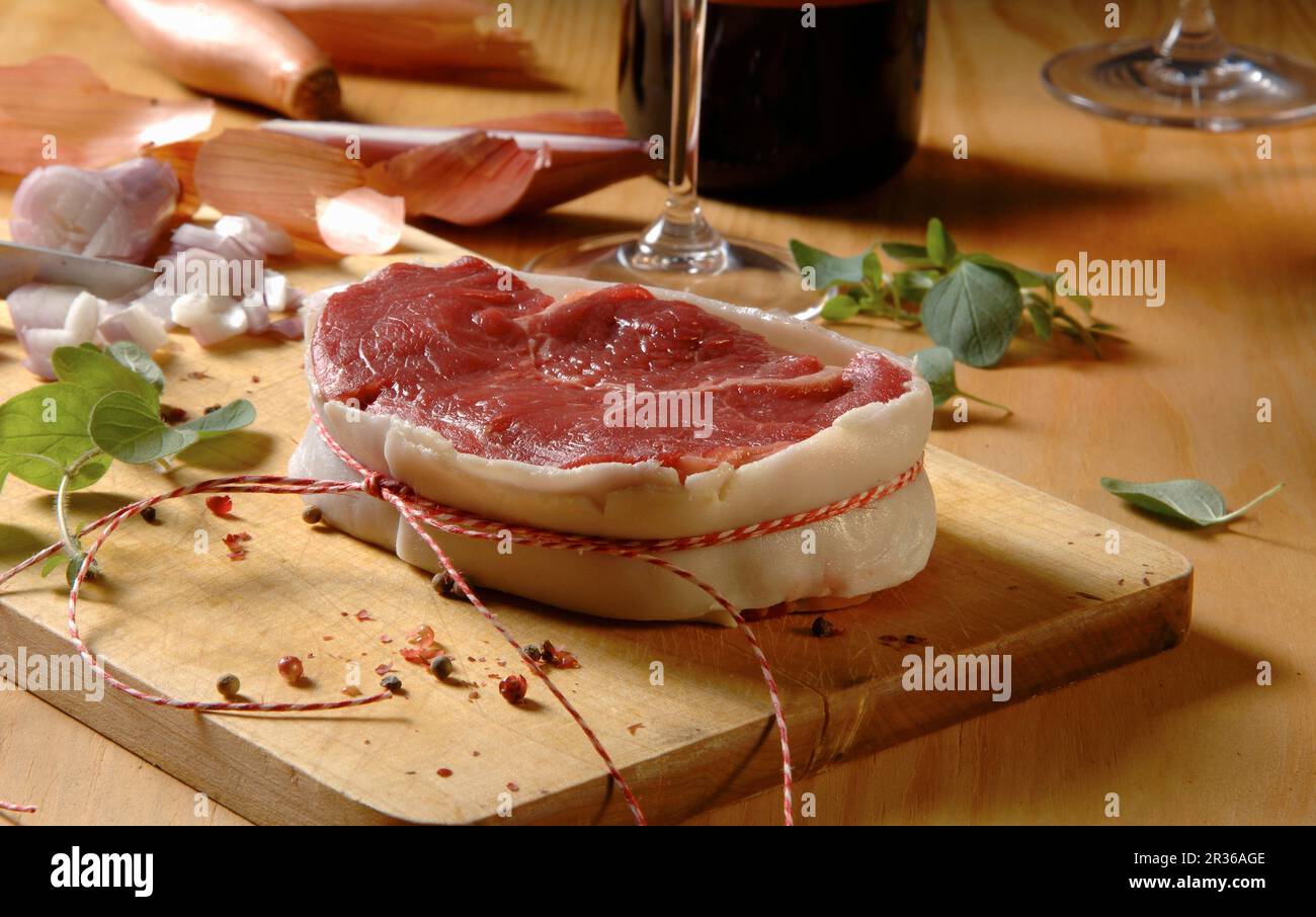 Raw beef fillet steak wrapped in bacon Stock Photo - Alamy