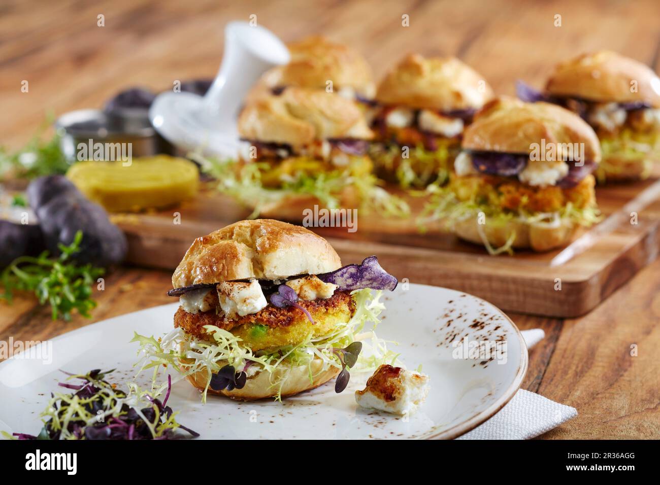 Mini veggie burgers with polenta patties, feta cheese and various types ...