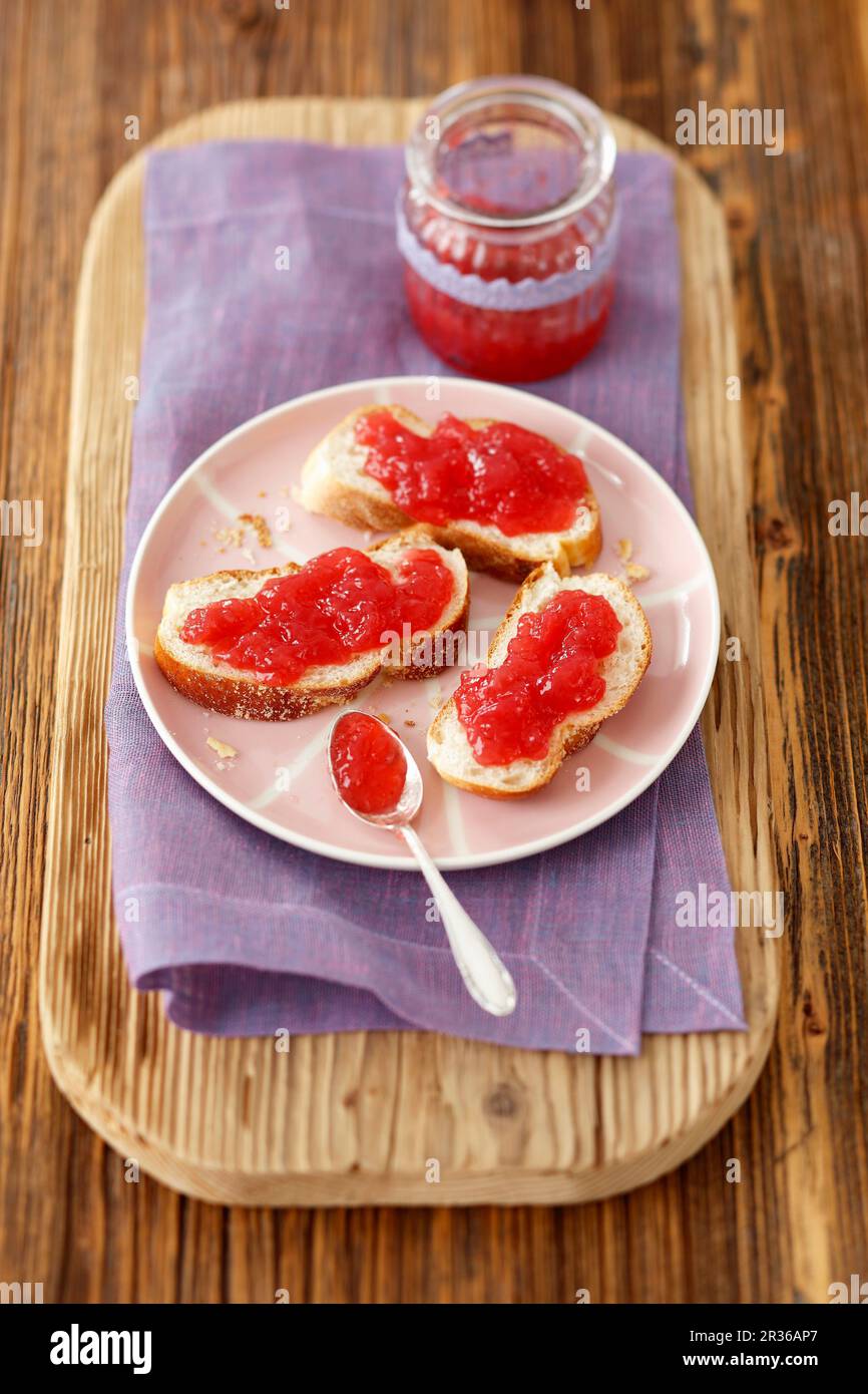 Plaited bread with strawberry jam Stock Photo - Alamy