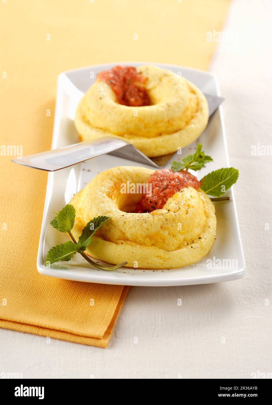 Ricotta flan with Pecorino cheese and tomato sauce Stock Photo - Alamy