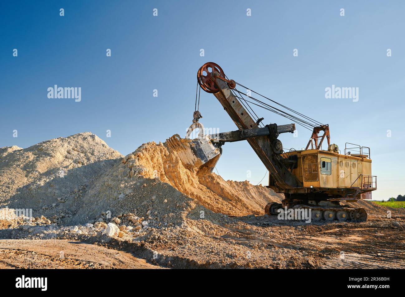 Shovel mining excavator operates in large open chalk quarry Stock Photo ...