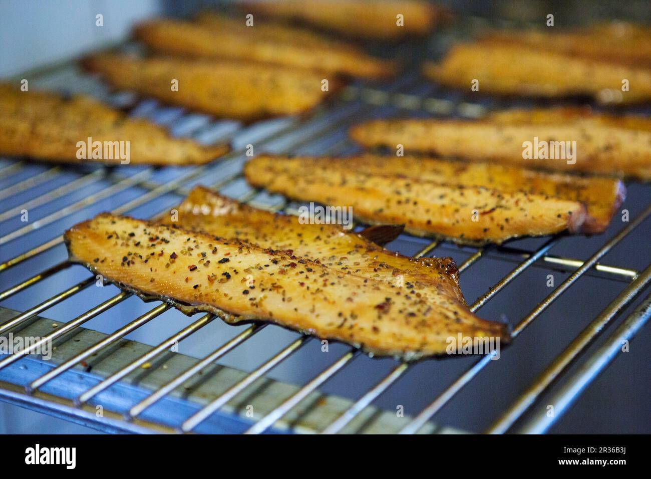 Smoked trout fillets on a cooking grid Stock Photo - Alamy