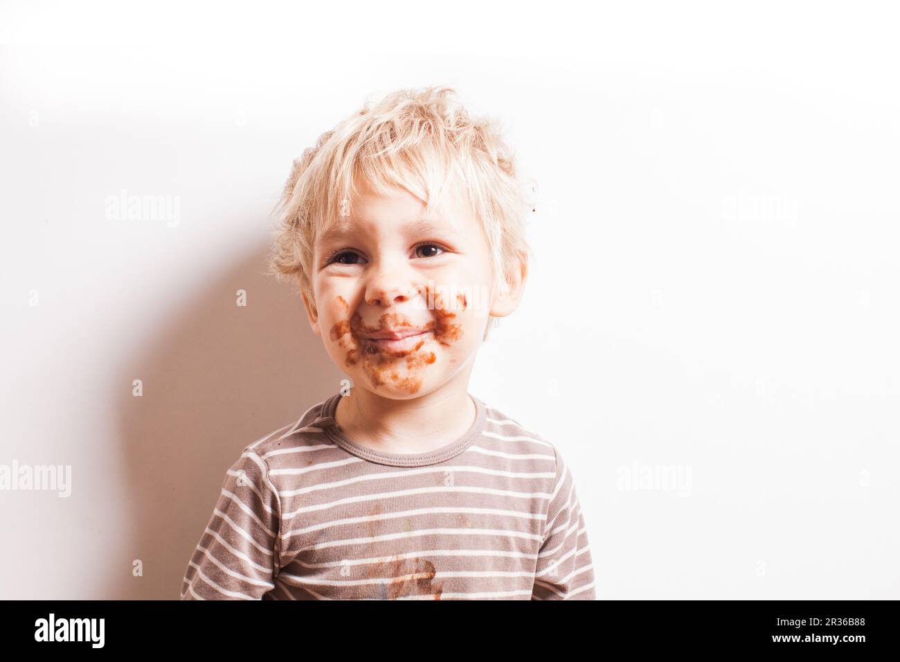 Boy eating chocolate messy hi-res stock photography and images - Alamy