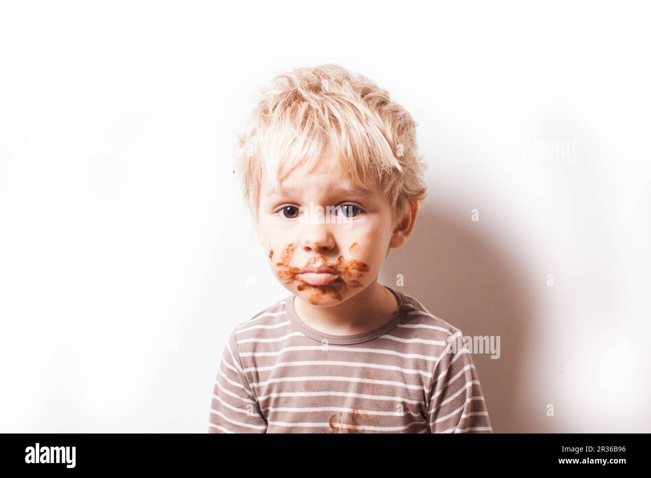 Boy eating chocolate messy hi-res stock photography and images - Alamy