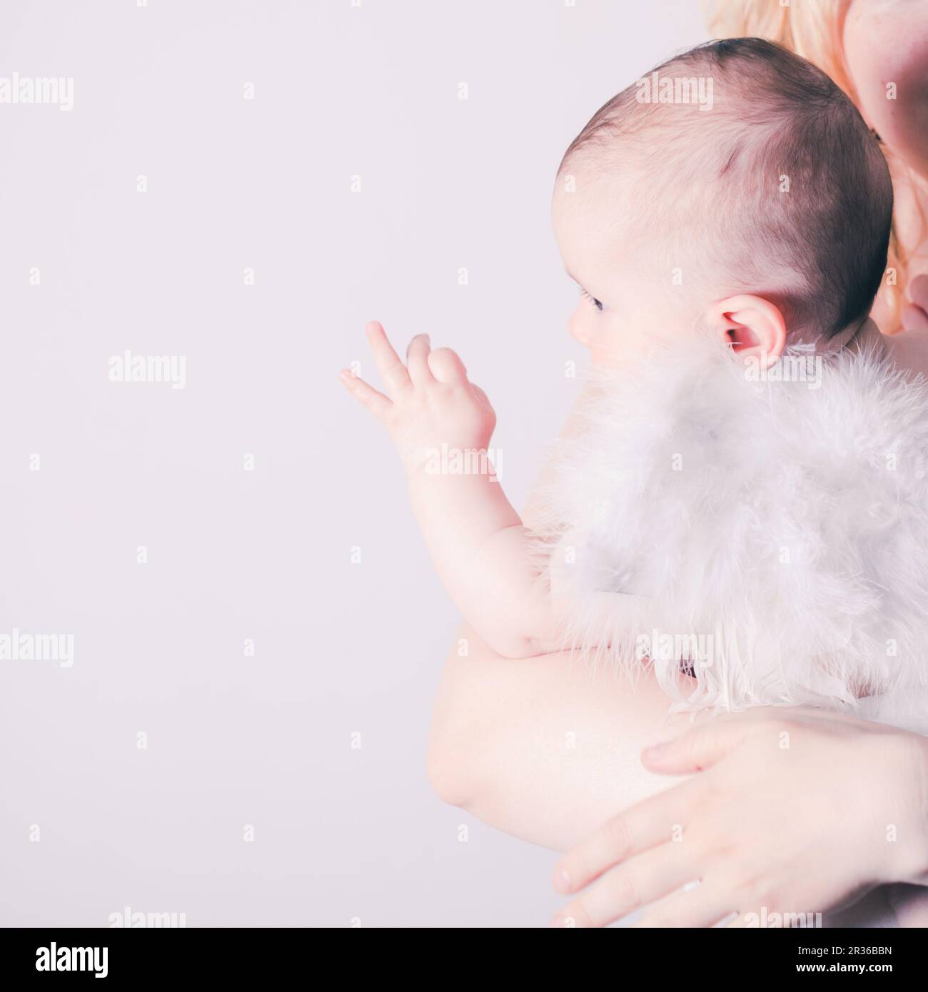 Portrait of mom with her baby angel Stock Photo - Alamy