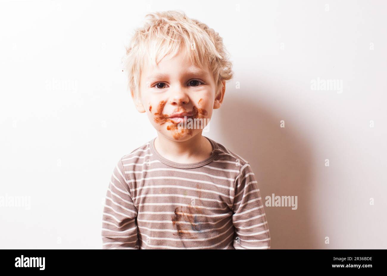Boy eating chocolate messy hi-res stock photography and images - Alamy