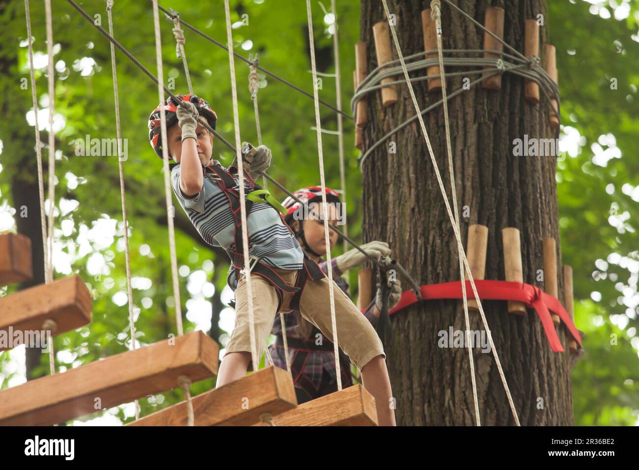 Child in a adventure playground Stock Photo - Alamy