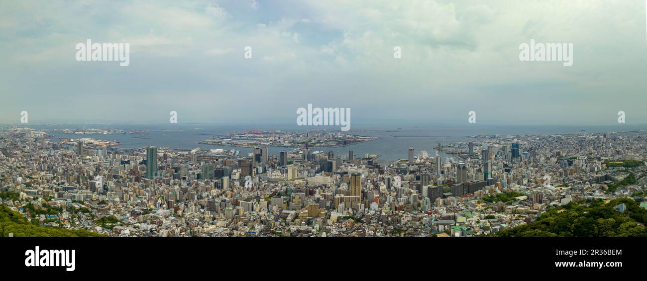 Panoramic view of downtown Kobe City, Port Island, and harbor on sunny ...