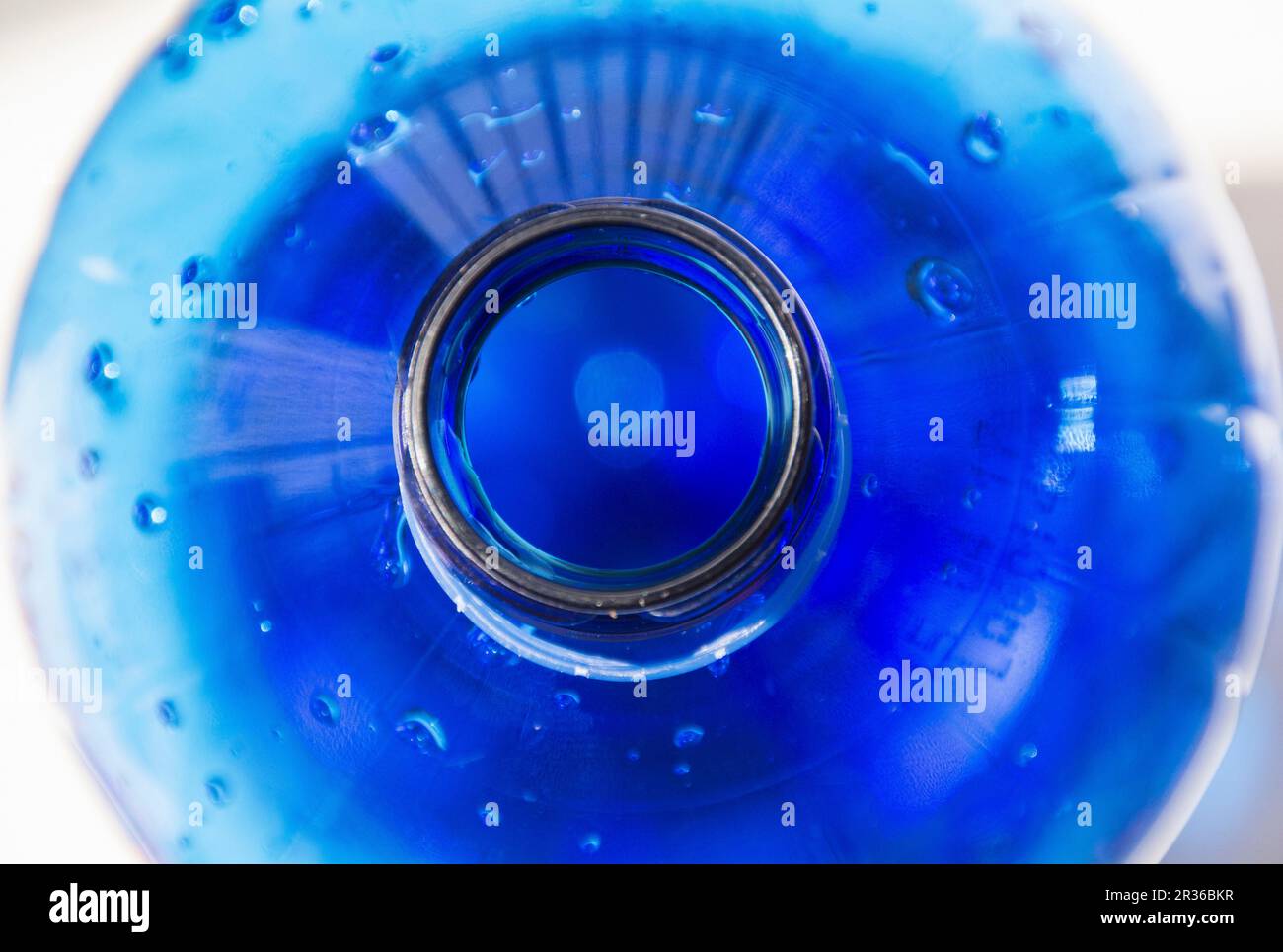 A blue bottle of water (seen from above Stock Photo - Alamy