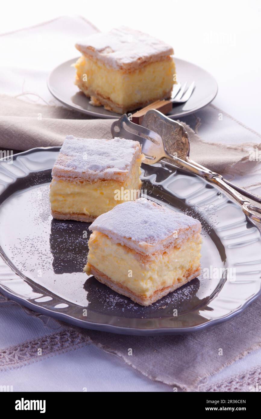 Puff pastry slices with vanilla cream Stock Photo - Alamy