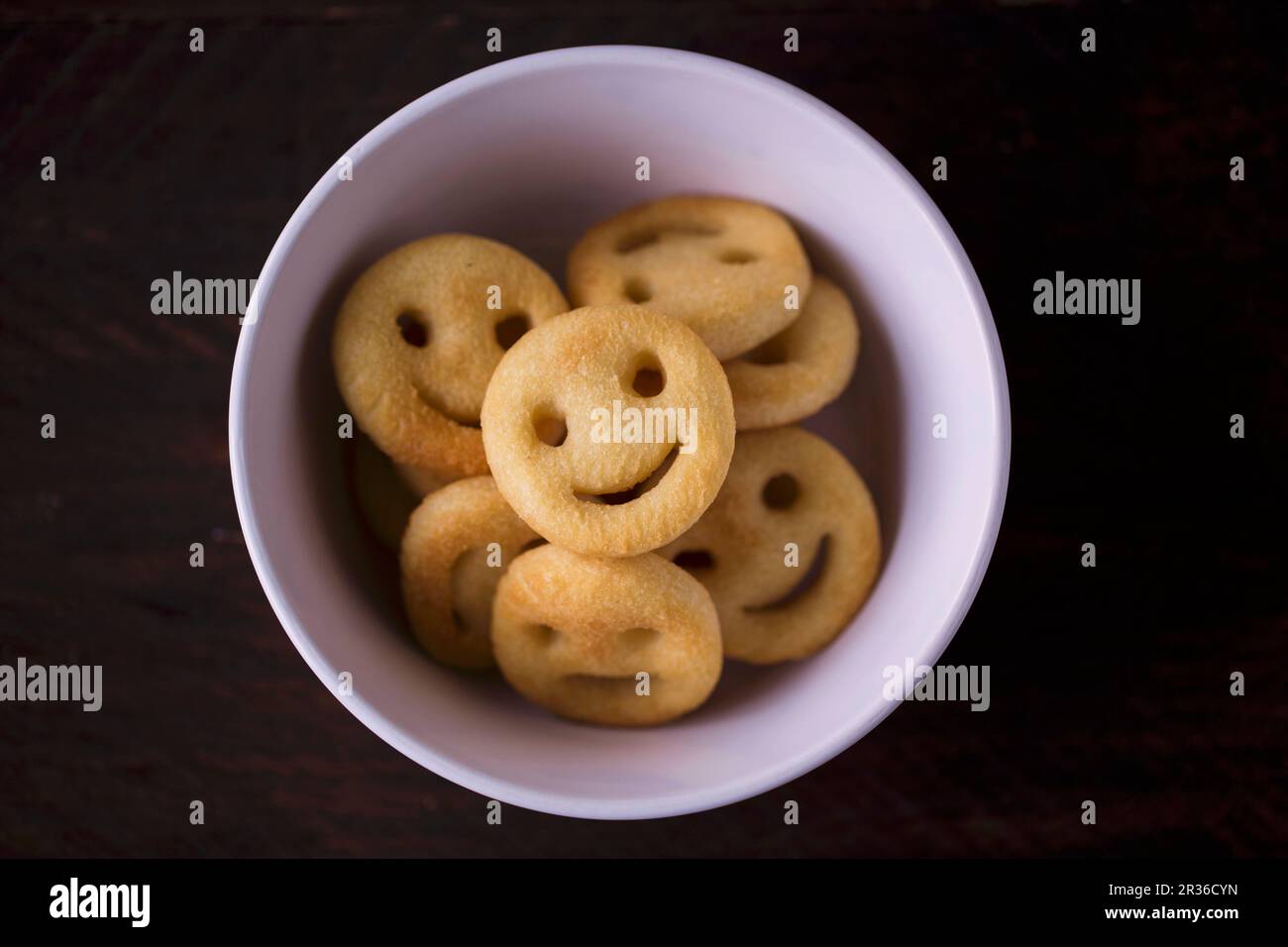 Potato smileys in a light bowl Stock Photo - Alamy