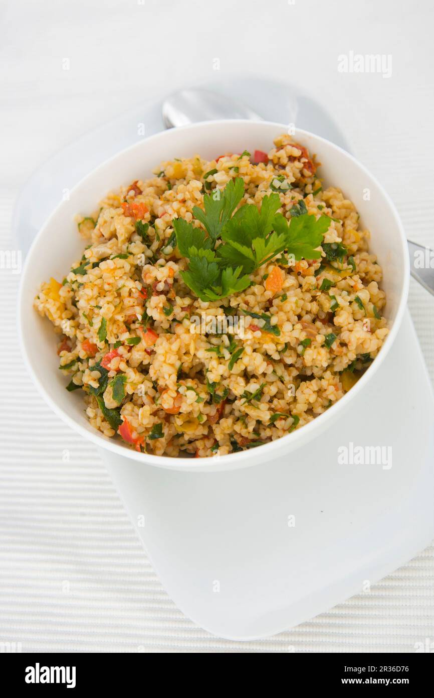 Fresh bulgur salad with flat leaf parsley Stock Photo - Alamy