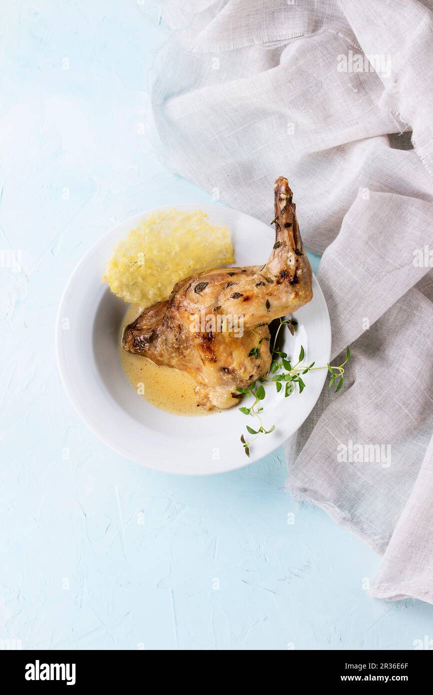 Leg of hare in a beer sauce with time and a Parmesan wafer Stock Photo ...