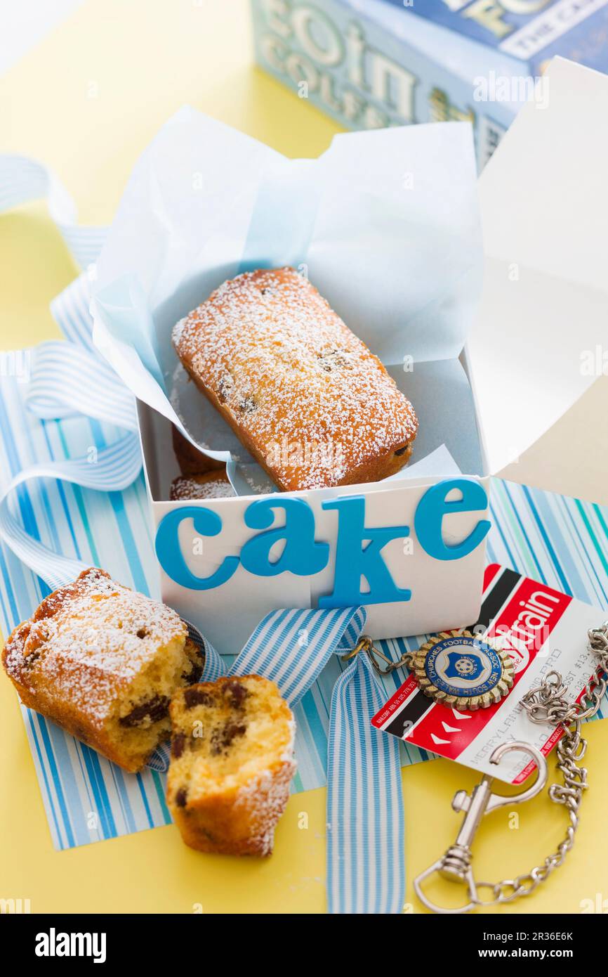 Mini raisin cakes dusted with icing sugar Stock Photo - Alamy
