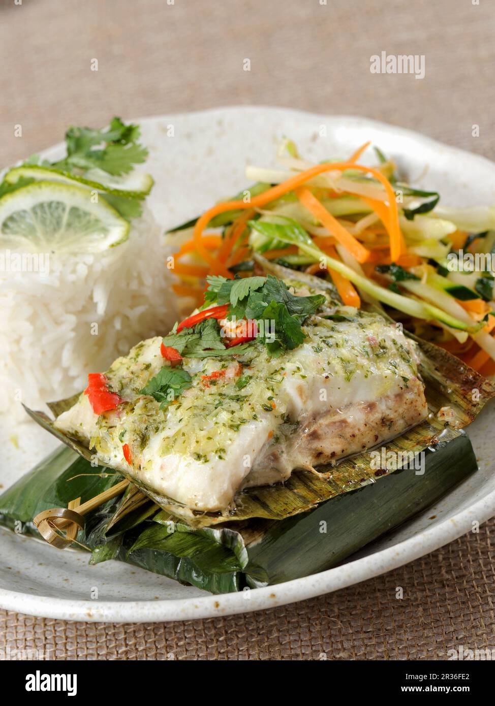 Fish in paper on a banana leaf Stock Photo - Alamy